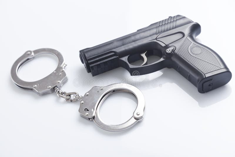 Handcuffs And Police Gun Stock Photo - Image: 44391367