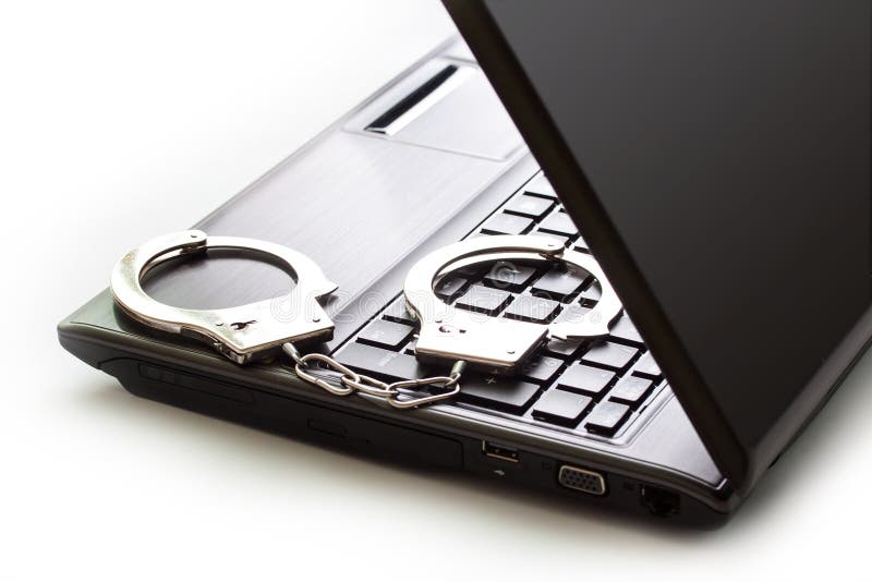 A Handcuffs Standing on Computer Keyboard. Stock Image - Image of ...