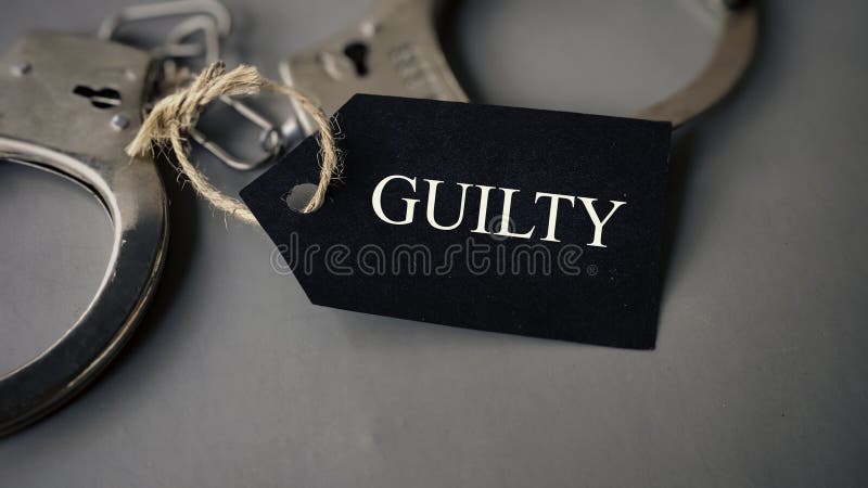 Handcuffs with a Tag Written Guilty Stock Image - Image of closeup ...