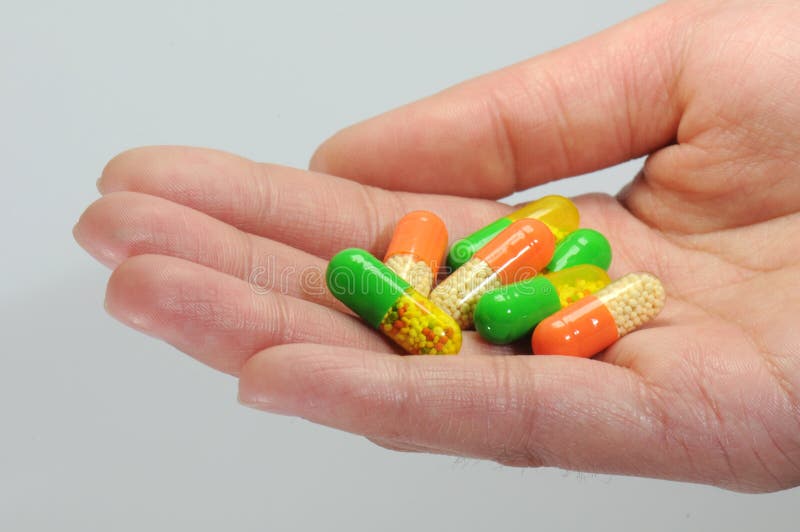 A Handful of Colorful Capsules Stock Photo - Image of closeup ...