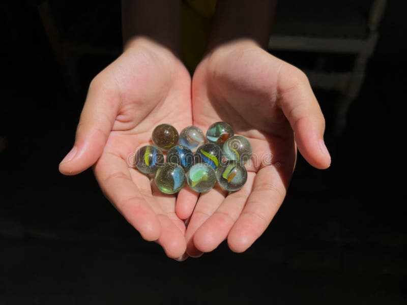 A Handful of Colorful Marbles Stock Photo - Image of games, bright ...