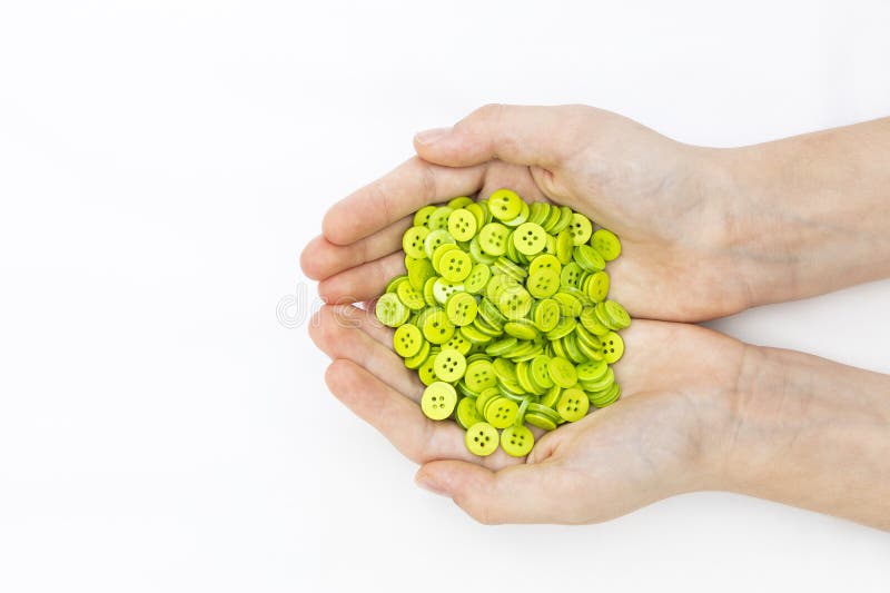 Handful of Green Buttonhole Buttons in the Hands Stock Photo - Image of ...