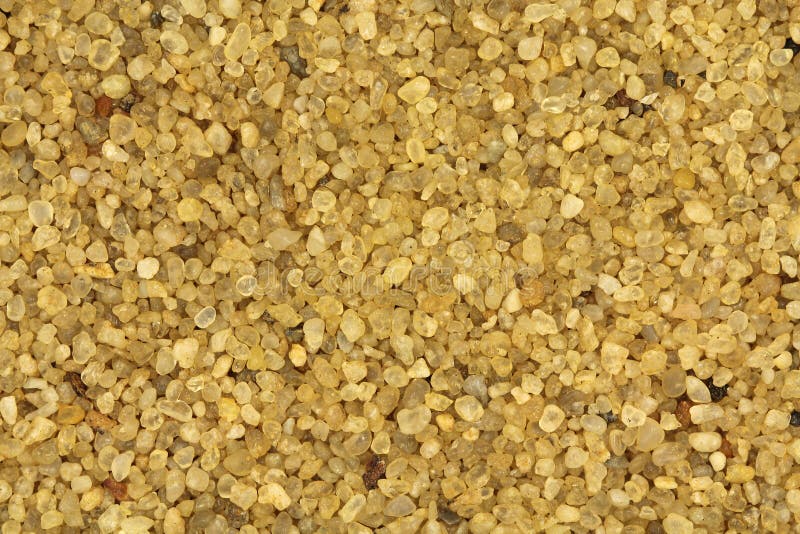 A Handful of Large Grains of Sand Background Stock Image - Image of ...