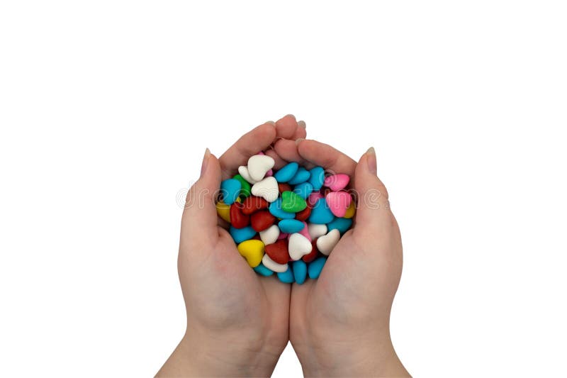 A Handful of Multi-colored Heart-shaped Sweets in Hands Stock Image ...