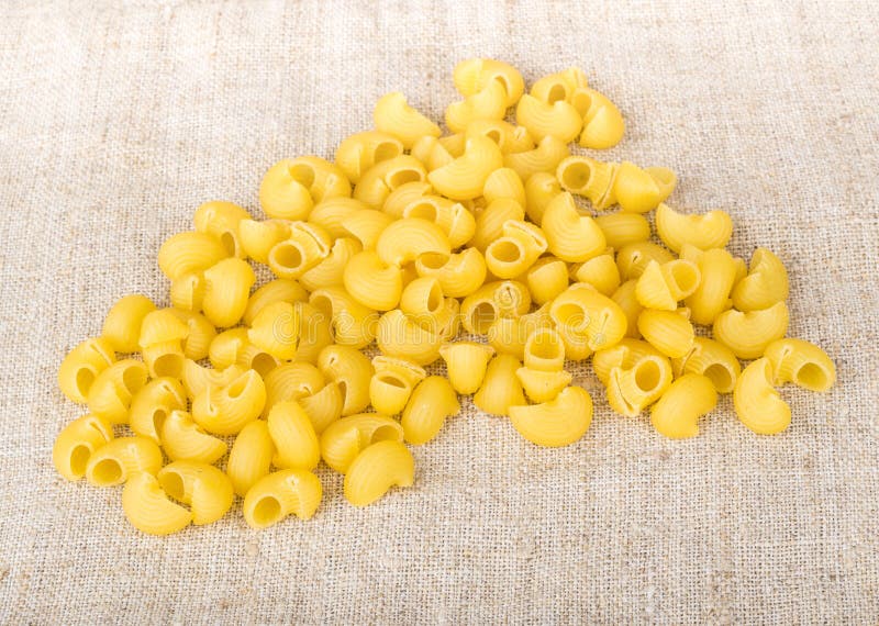Handful of pasta on burlap stock photo. Image of horizontal - 53397496