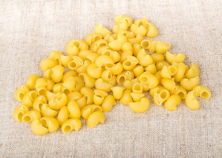 Handful of pasta on burlap stock photo. Image of horizontal - 53397496
