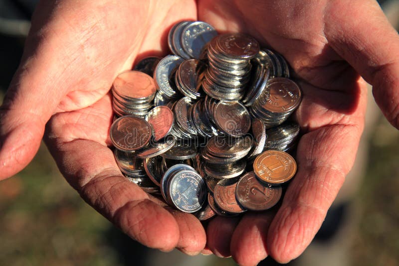A handful of silver coins stock photo. Image of poverty - 95789822