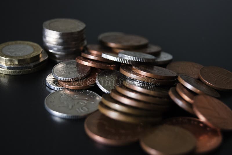 Coins on tabletop stock photo. Image of varied, great - 183436566