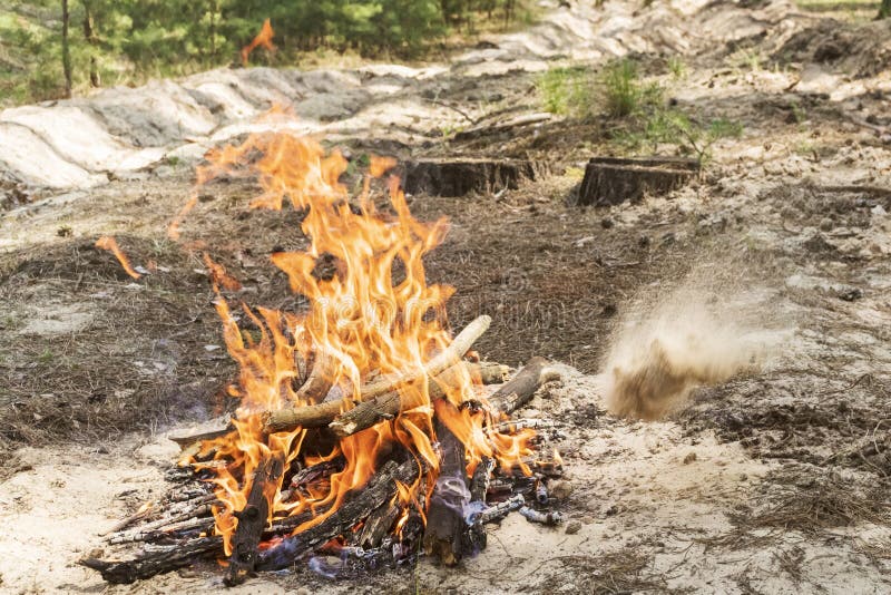Fire in sand stock photo. Image of burn, making, sand - 123073358