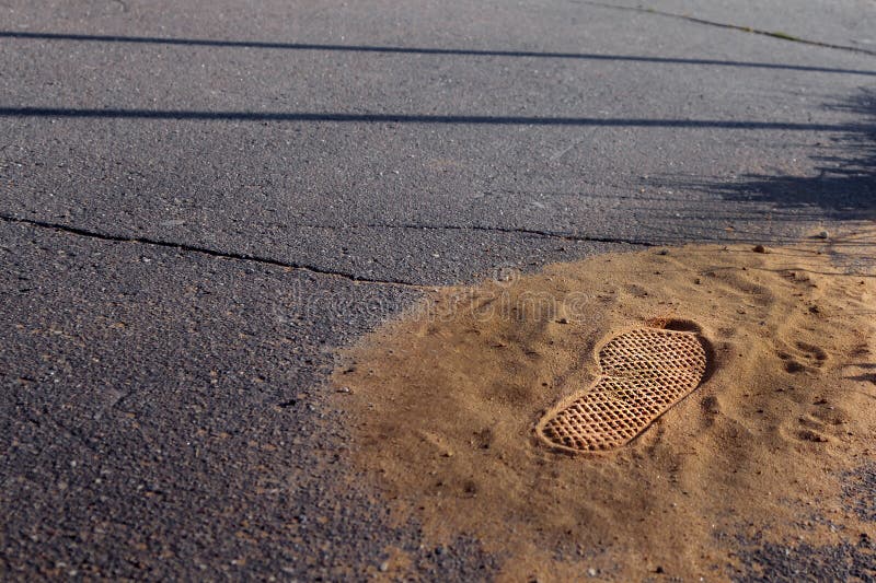 Handful of Sand on Pavement with a Boot Mark Stock Photo - Image of ...