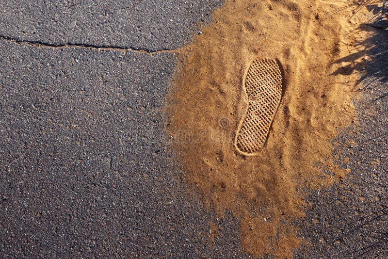Handful of Sand on Pavement with a Boot Mark Stock Photo - Image of ...
