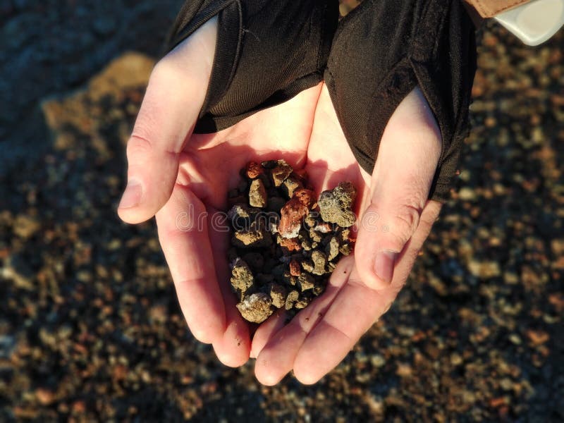 A Handful of Stones of Different Rocks in the Hands Close-up Stock ...