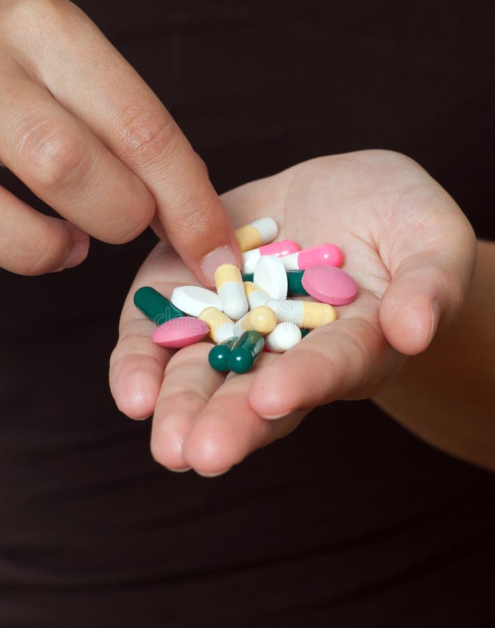 Vitamins and Supplements. Woman Hands Full of Medication Pills Stock ...