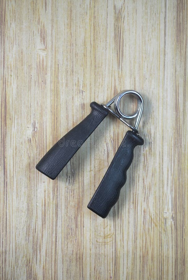 Hand Grip Tool on Wooden Table Background Stock Image - Image of ...