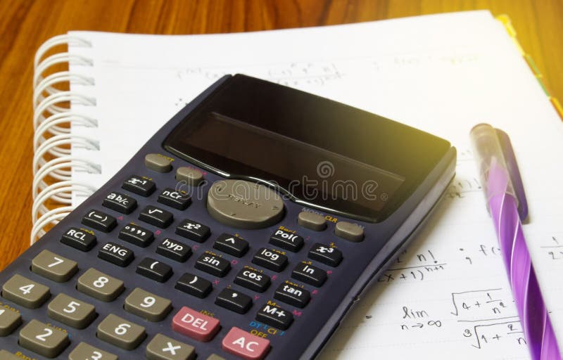 Handheld Calculator on a Sheet of Paper Stock Image - Image of calculus ...