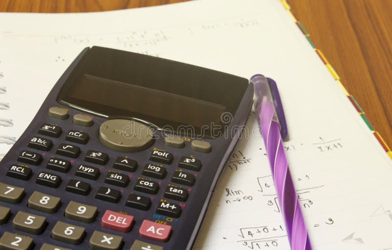 Handheld Calculator on a Sheet of Paper Stock Image - Image of calculus ...