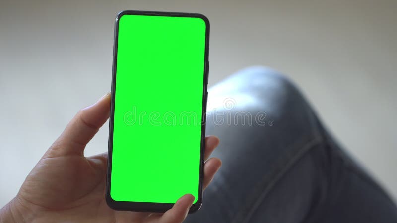 Handheld Camera: Back View of Brunette Holding Chroma Key Green Screen ...