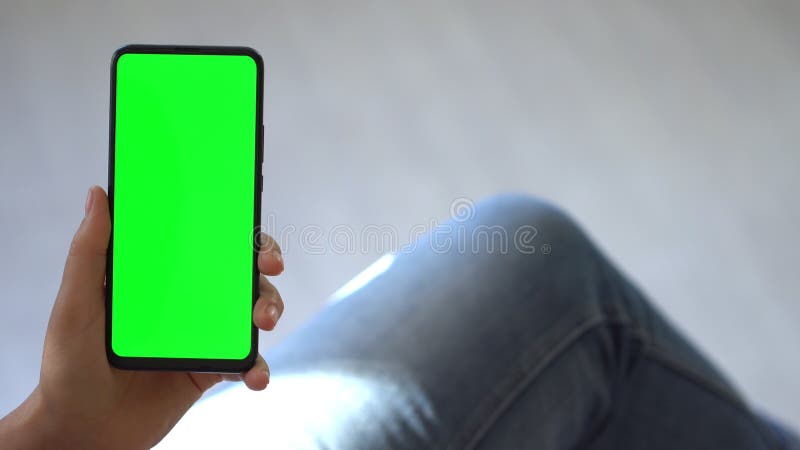 Handheld Camera: Back View of Brunette Holding Chroma Key Green Screen ...