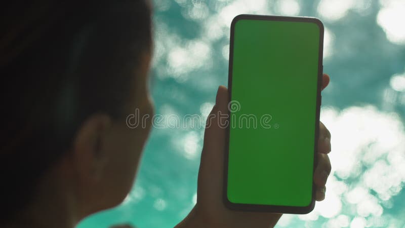 Handheld Camera: Back View of Brunette Holding Chroma Key Green Screen ...
