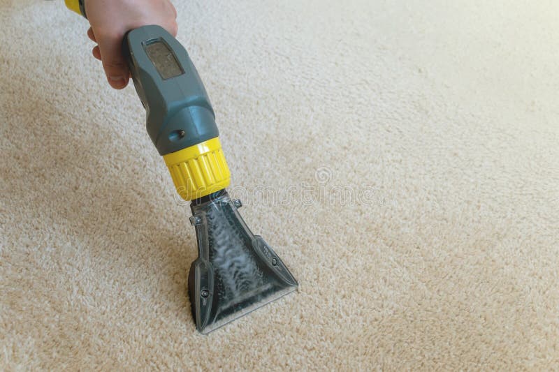 Handheld Carpet Cleaner in Action on Beige Carpet for Home Cleaning ...