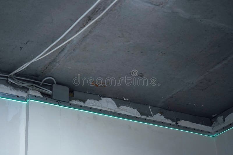 A Handheld Laser Level Projects a Single Green Line Onto the Ceiling ...