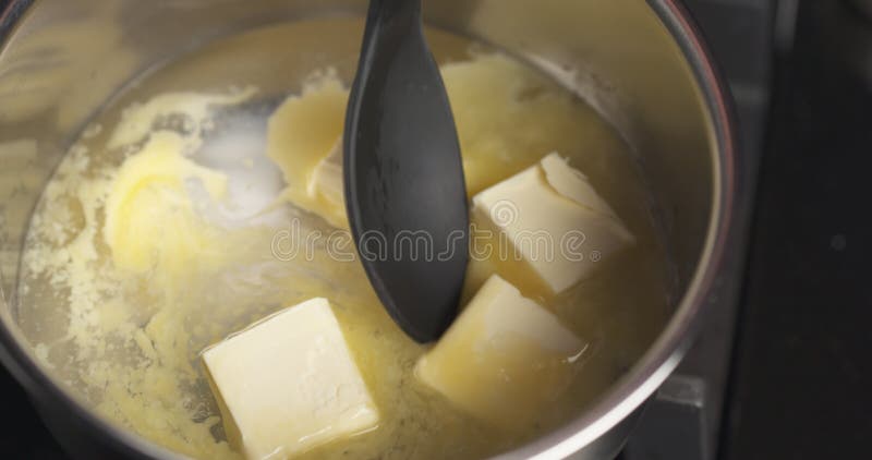 Handheld Shot of Butter Melting in Water Stock Photo - Image of butter ...