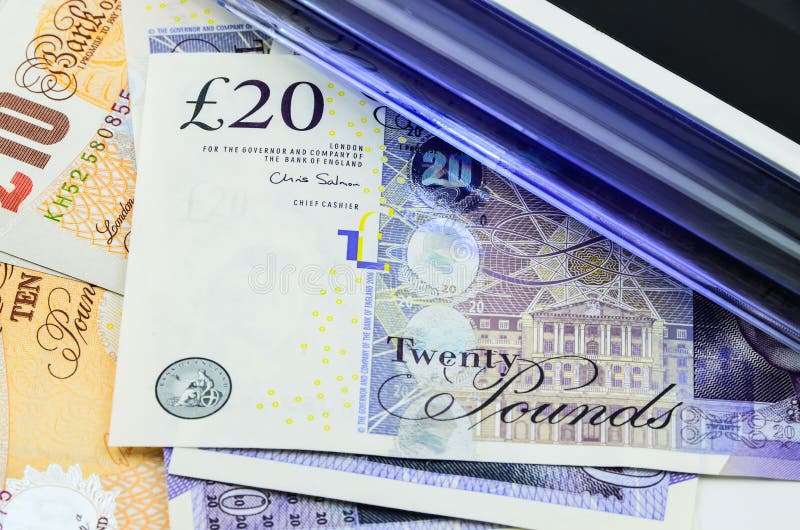 Handheld Ultraviolet light editorial stock photo. Image of banknotes ...