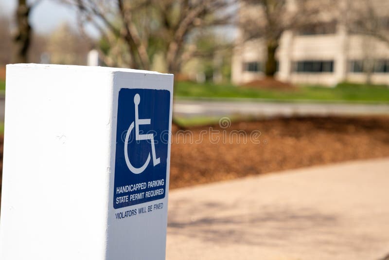 Handicap Parking Sign on a Pole Stock Photo - Image of field, reserved ...