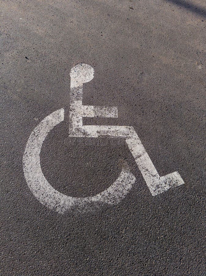 A Handicap Sign Painted on the Ground in a Parking Lot Stock Image ...