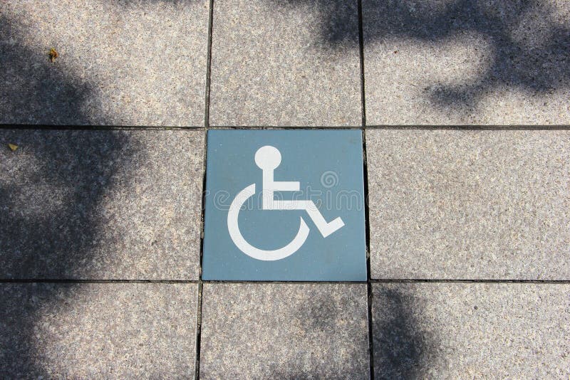 Handicap Sign on Tile Floor Stock Image - Image of transport ...