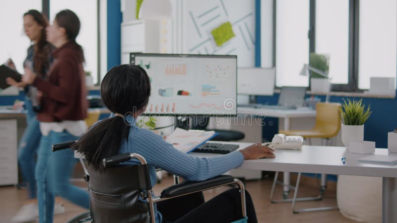 Handicapped Worker Immobilized in Wheelchair Looking at Pc with Chroma ...