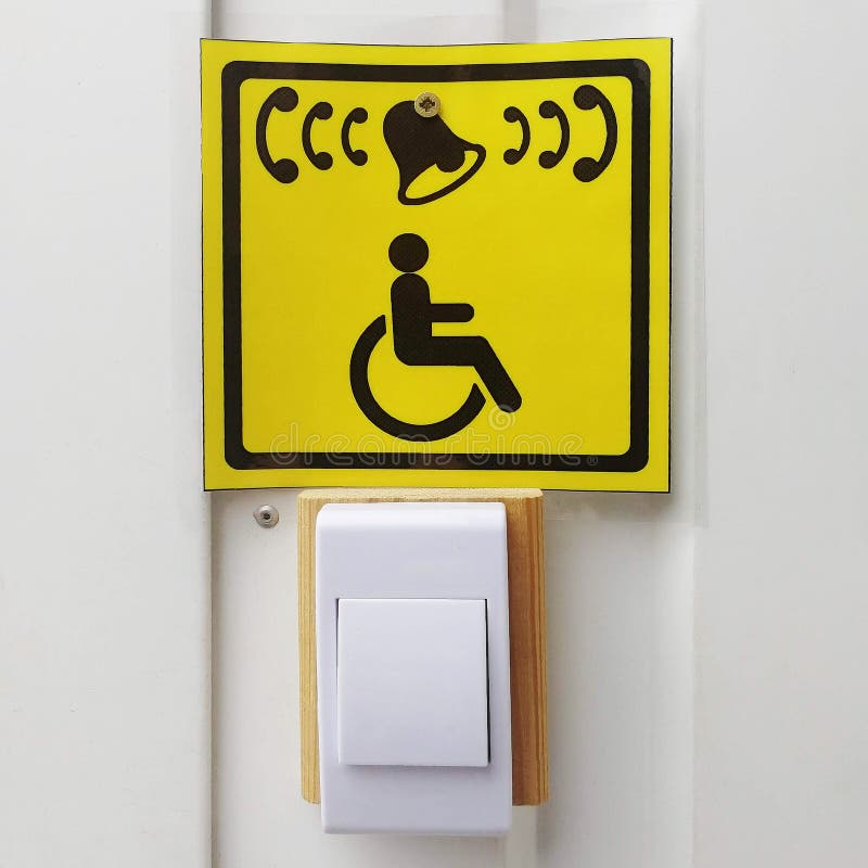 Handicapped Call Button and Yellow Sign with Icon on White Wall Stock ...