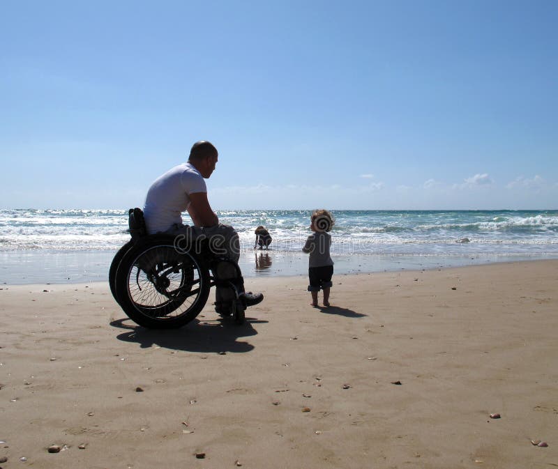 Handicapped Dad with Child stock photo. Image of disabled - 9877858