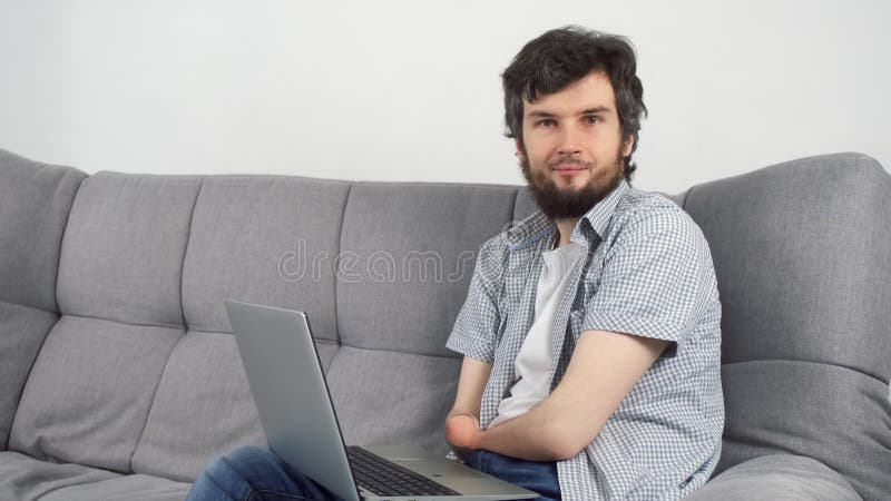 Disabled Man with Amputated Two Stump Hands Working on Laptop Looking ...