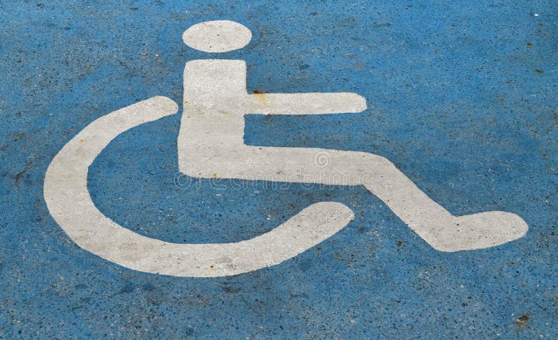 Handicapped or Disabled Parking Sign on Blue Asphalt Stock Photo ...