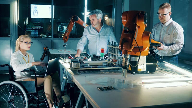 Disabled Engineer and Her Coworkers are Discussing Robots Stock Video ...