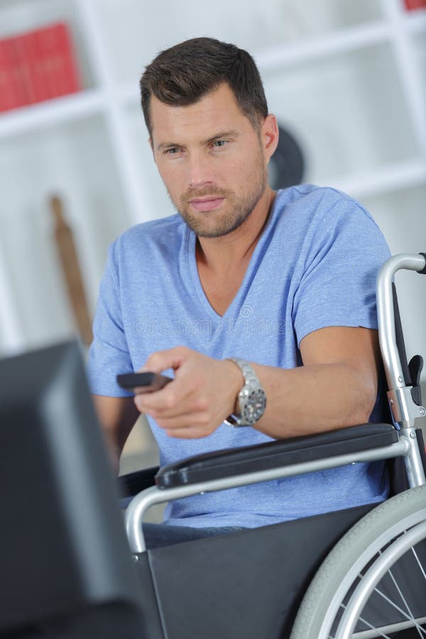 Handicapped Man Watching Television in Living Room Stock Photo - Image ...