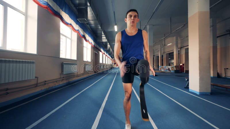 Handicapped Sprinter Training on a Track, Bionic Prosthesis. Stock ...