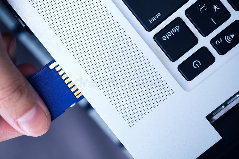 Handing inserting SD Card stock image. Image of backup - 72169543
