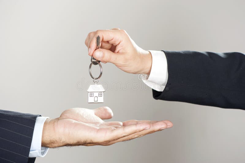 Handing over house keys stock image. Image of banking - 72839431