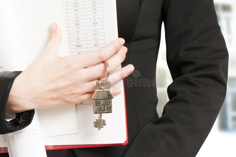 Handing over house keys stock photo. Image of finance - 75595276