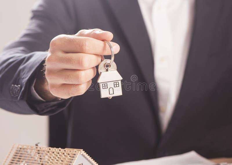 Handing over house keys stock photo. Image of handing - 95212476