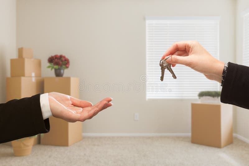 Woman Handing Over the House Keys Inside Empty Room Stock Image - Image ...