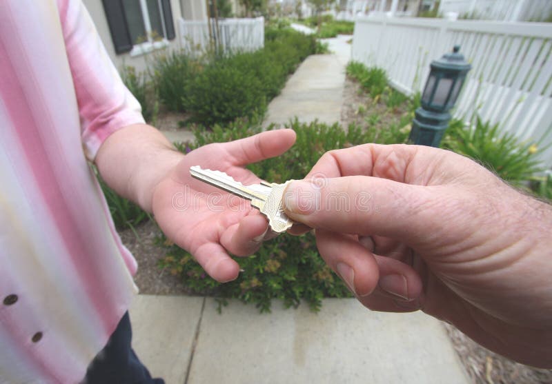 Handing Over the Key stock image. Image of daytime, home - 5303759