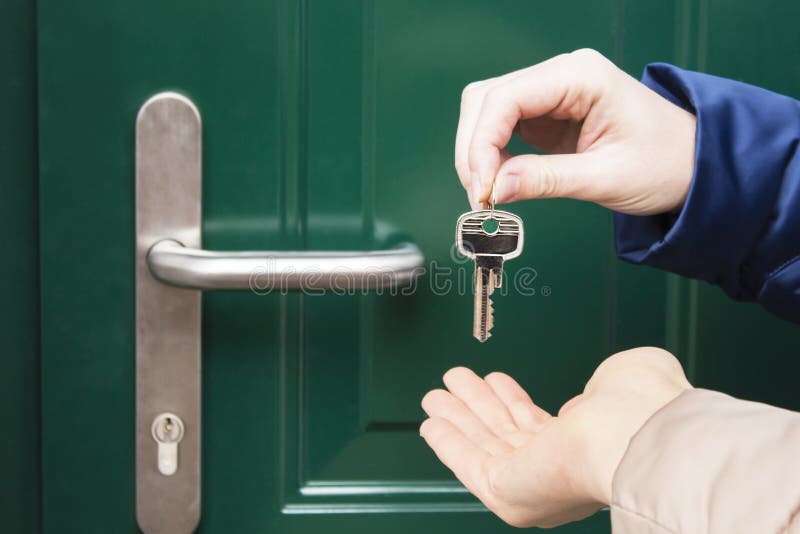 Handing Over the Key from a New Home. Stock Image - Image of facade ...