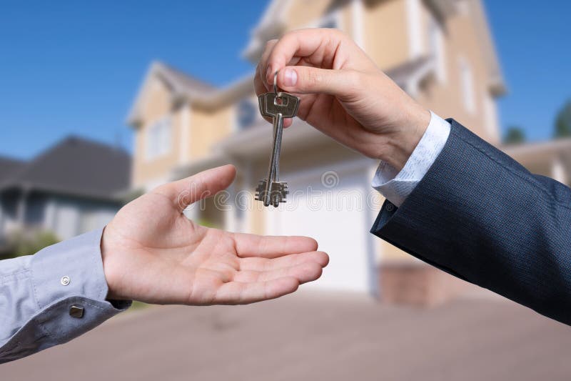 Handing Over the New House Keys with Home in the Background. Stock ...