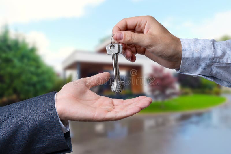 Handing Over the New House Keys with Home in the Background. Stock ...