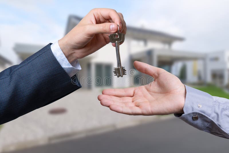 Handing Over the New House Keys with Home in the Background. Stock ...