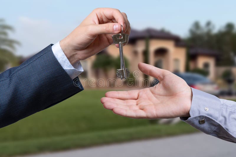 Handing Over the New House Keys with Home in the Background. Stock ...