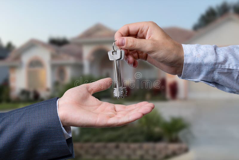 Handing Over the New House Keys with Home in the Background. Stock ...